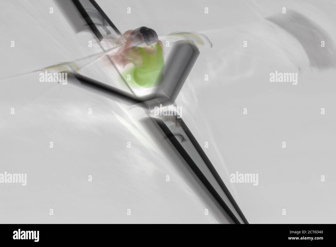 A single scull boat and rower on the water, view from above. Motion ...