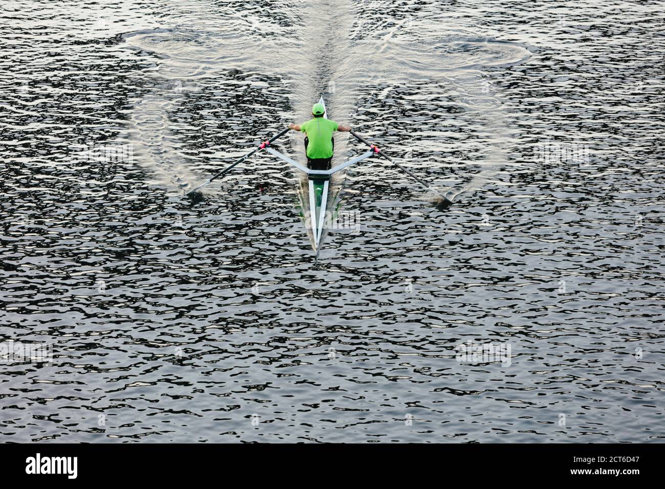 A single scull boat and rower on the water, view from above Stock Photo ...