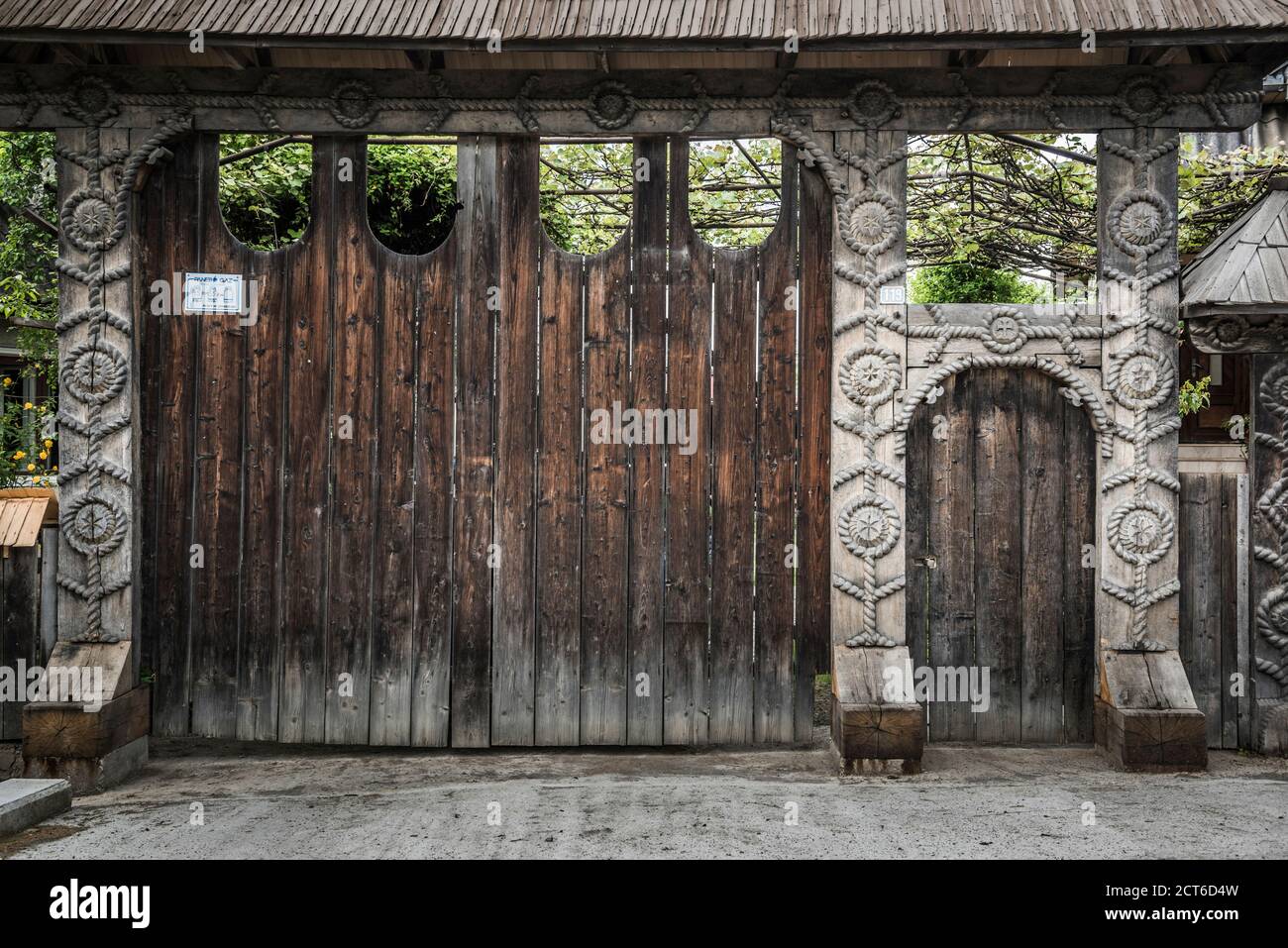 Traditional Romanian wooden decorated gate, found in the Maramures and ...
