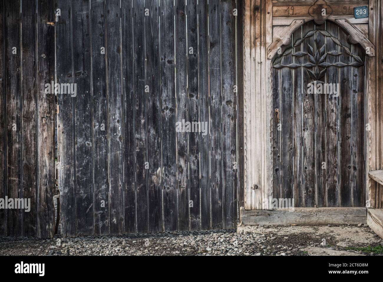 Traditional Romanian wooden decorated gate, found in the Maramures and ...