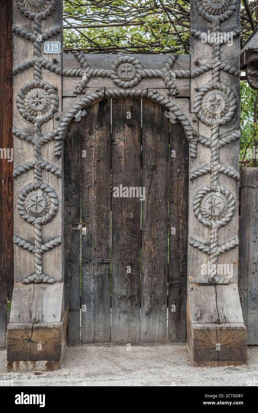 Traditional Romanian wooden decorated gate, found in the Maramures and ...