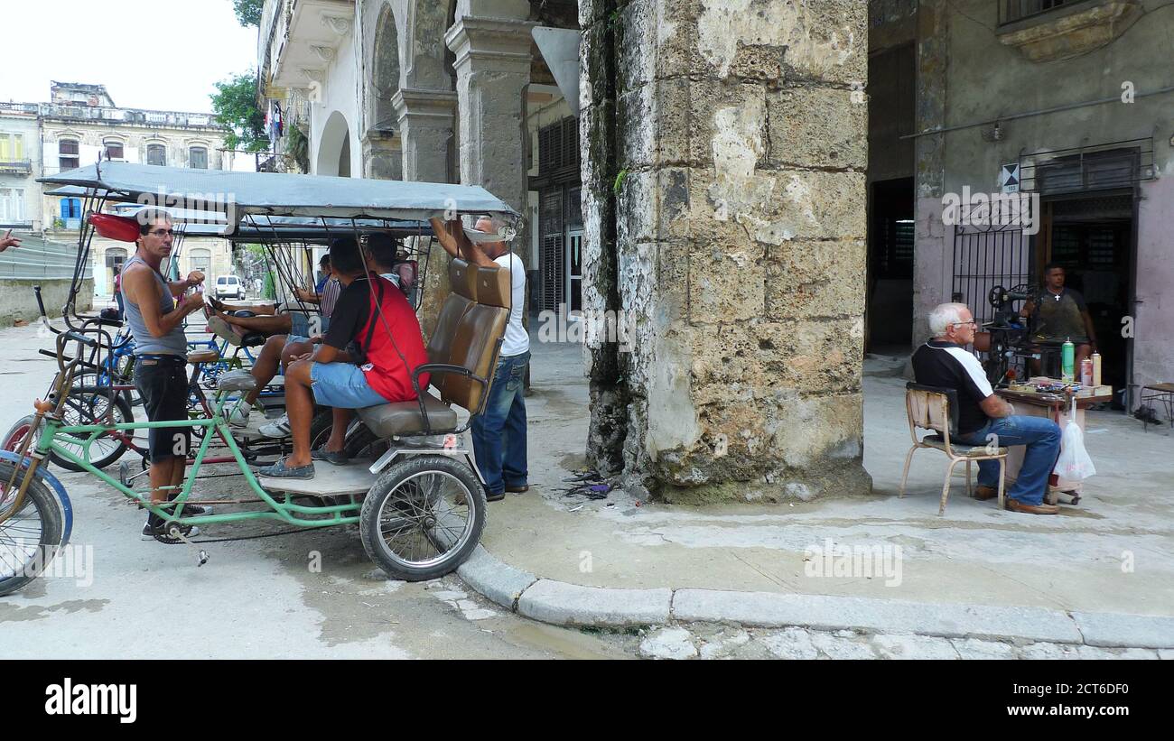 SOME MEN WITH THEIR PEDAL RICKSHAW WAITING FOR CUSTOMERS Stock Photo ...