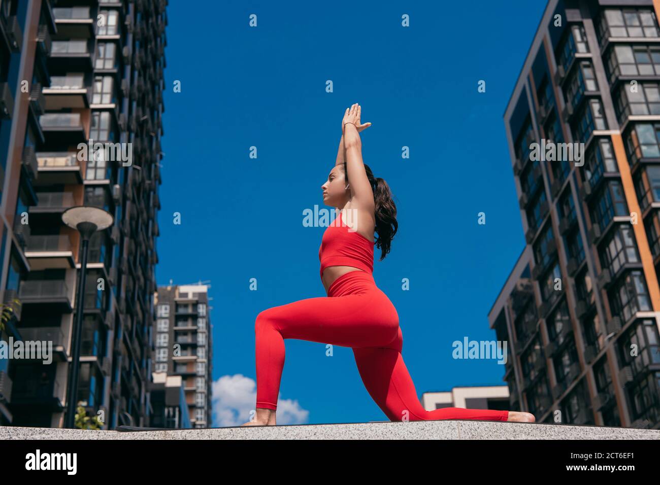Athletic fit woman practice Low Lunge pose with raised arms. Young ...
