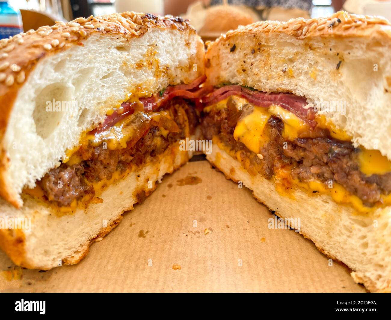 Delicious handmade hamburger cut in half ready to eat Stock Photo - Alamy