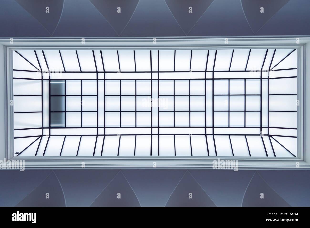 Looking up at bright skylight window in roof of a museum Stock Photo ...