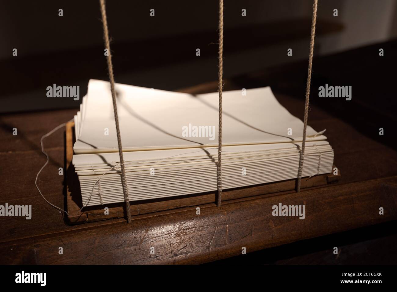 Tools in historic bookbinder workshop for stitching together the pages ...