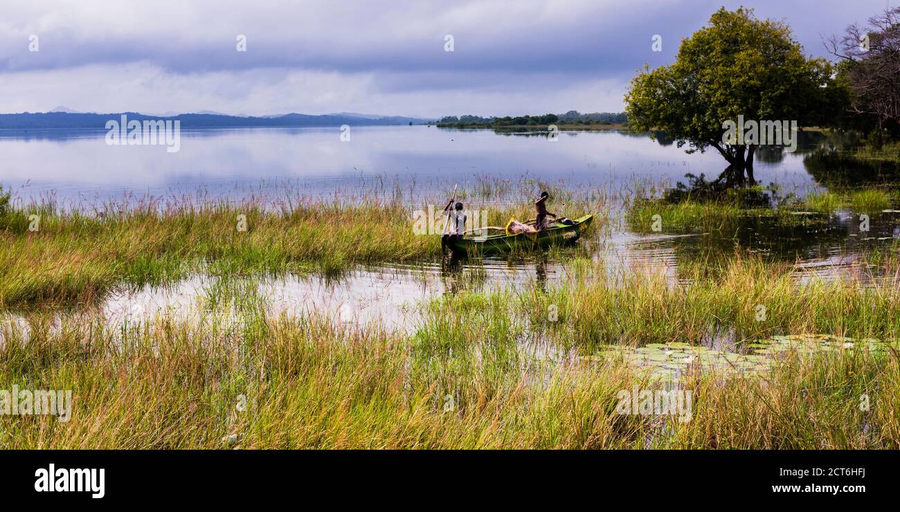 Minneriya National Park, fishermen fishing on Minneriya Lake, Central ...