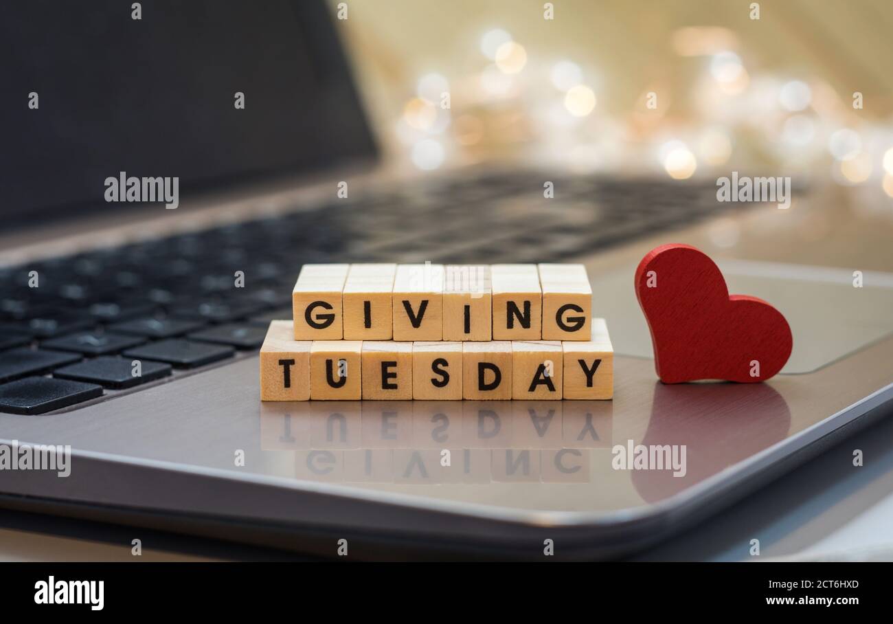 GIVING TUESDAY letter blocks concept on laptop keyboard Stock Photo - Alamy