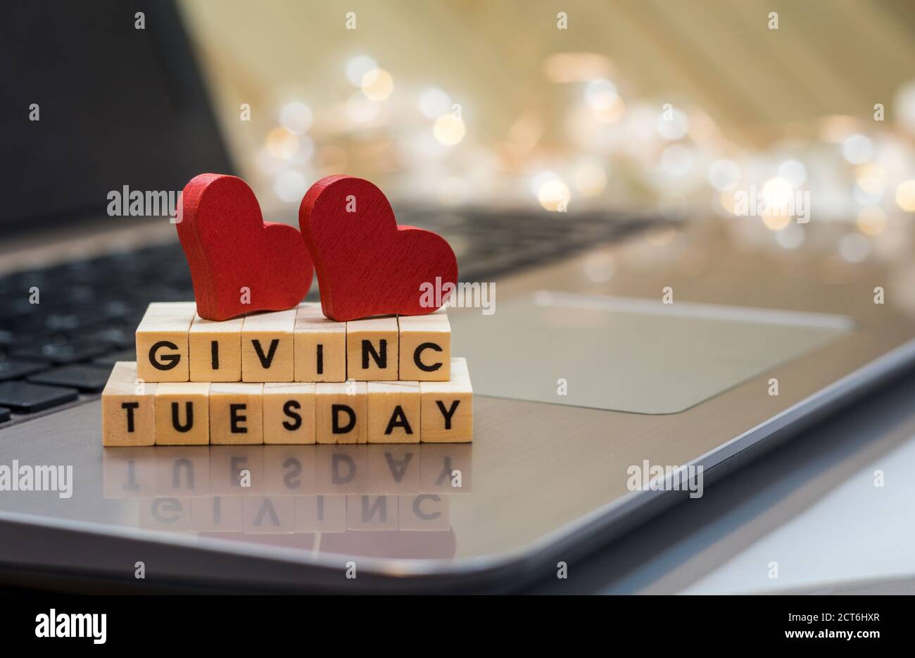 GIVING TUESDAY letter blocks concept on laptop keyboard Stock Photo - Alamy