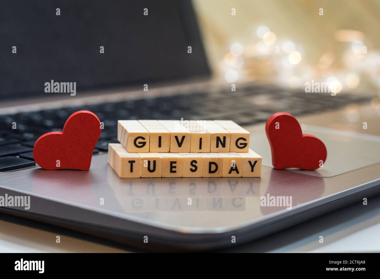 GIVING TUESDAY letter blocks concept on laptop keyboard Stock Photo - Alamy