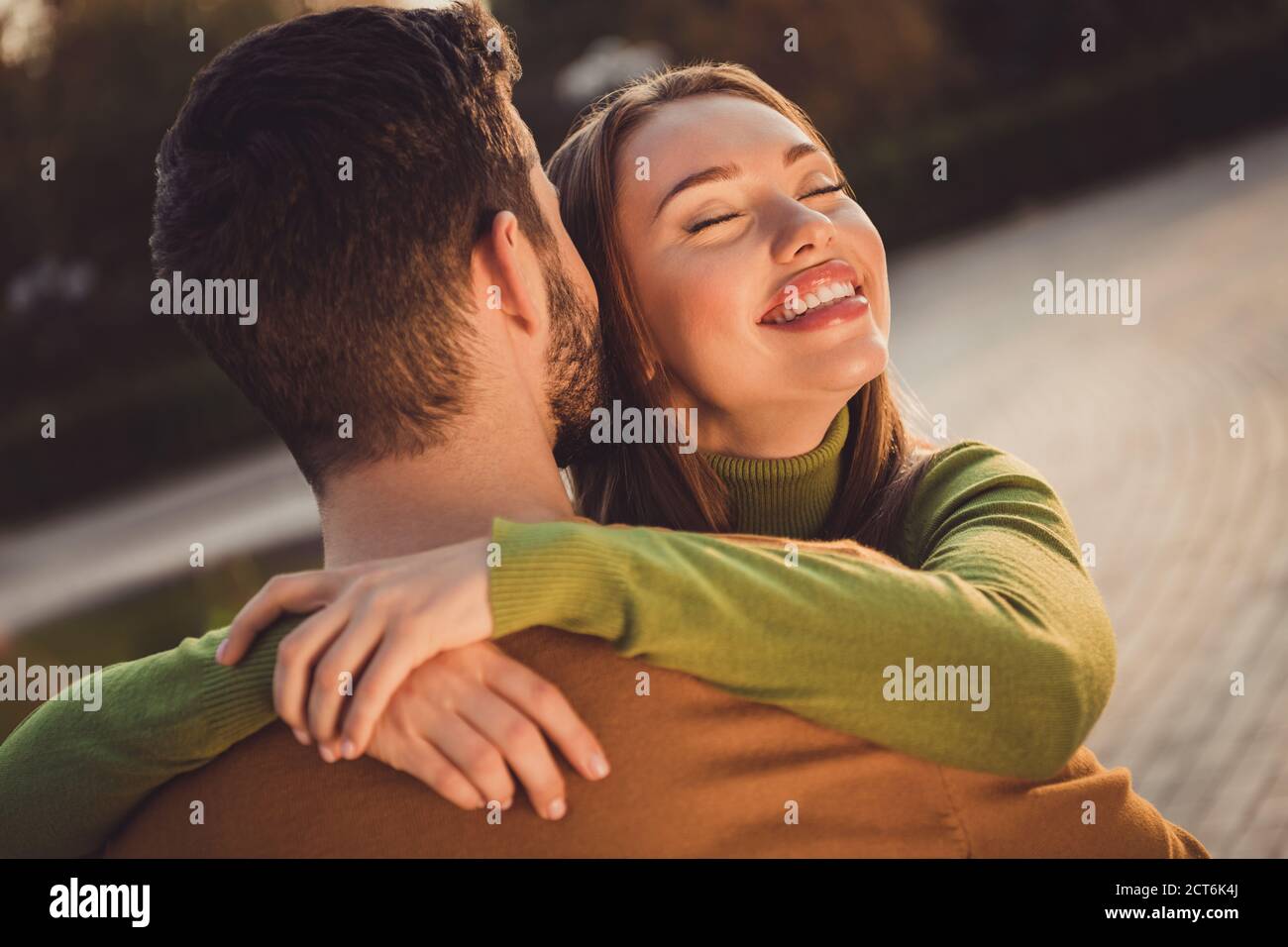 back rear spine view photo of charming girl enjoy cuddle hugging her ...