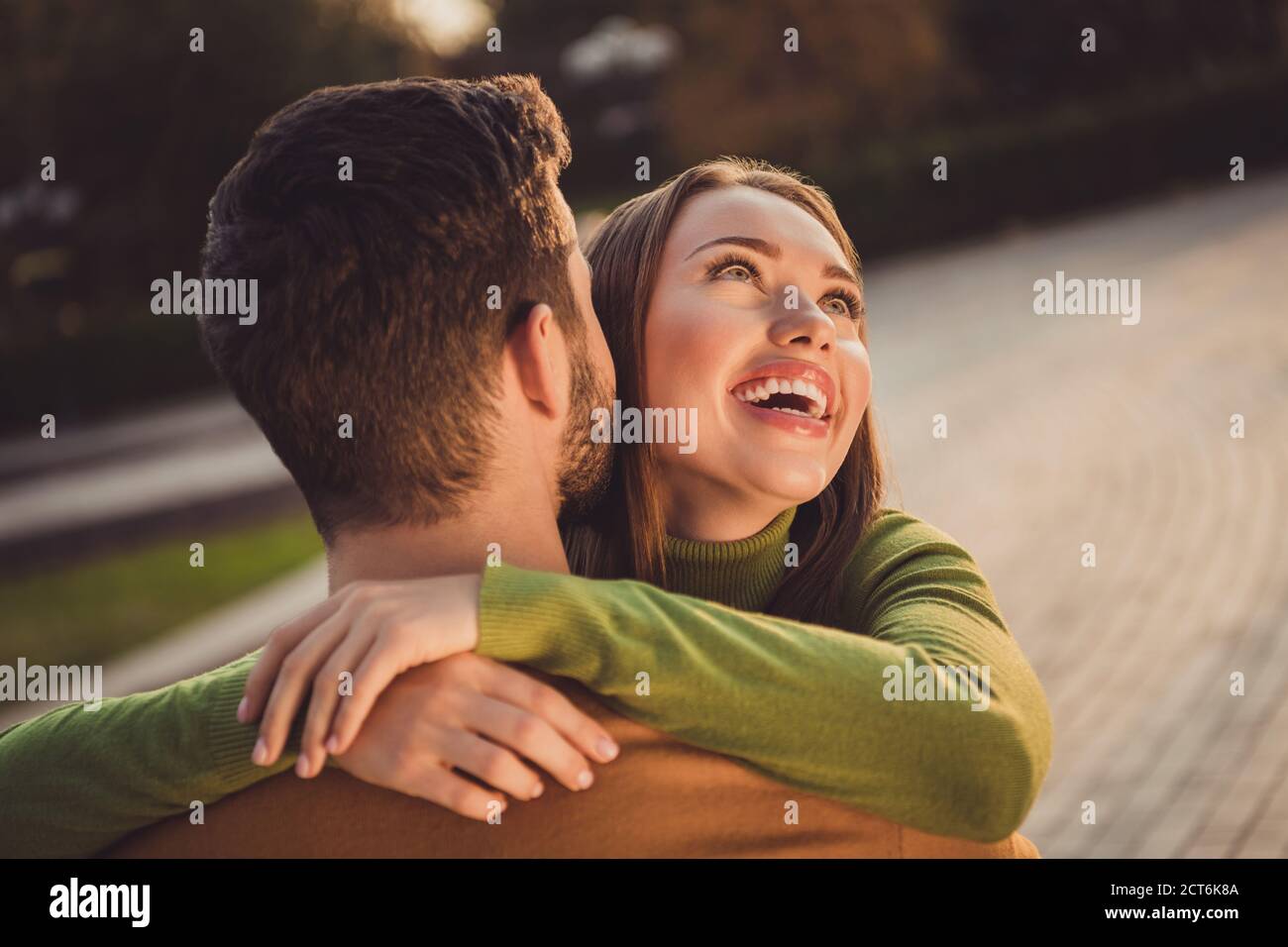 Back rear spine view portrait of passionate bonding girl hug boyfriend ...