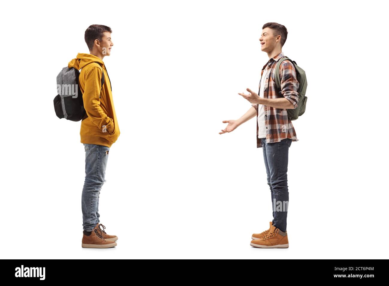 Full length profile shot of two male teenage students having a ...