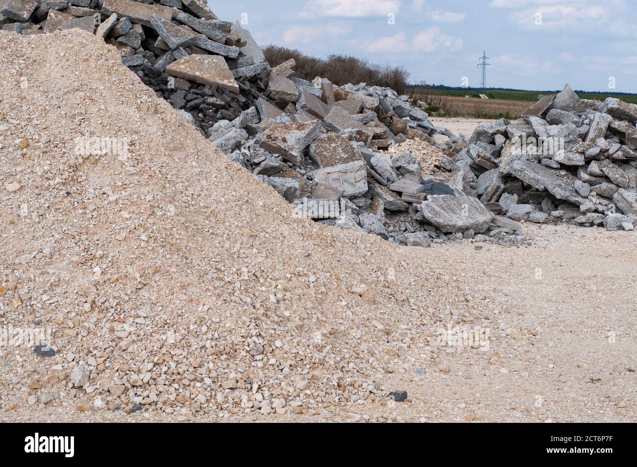 heaps of gravel and damaged rubble at a road construction site Stock ...