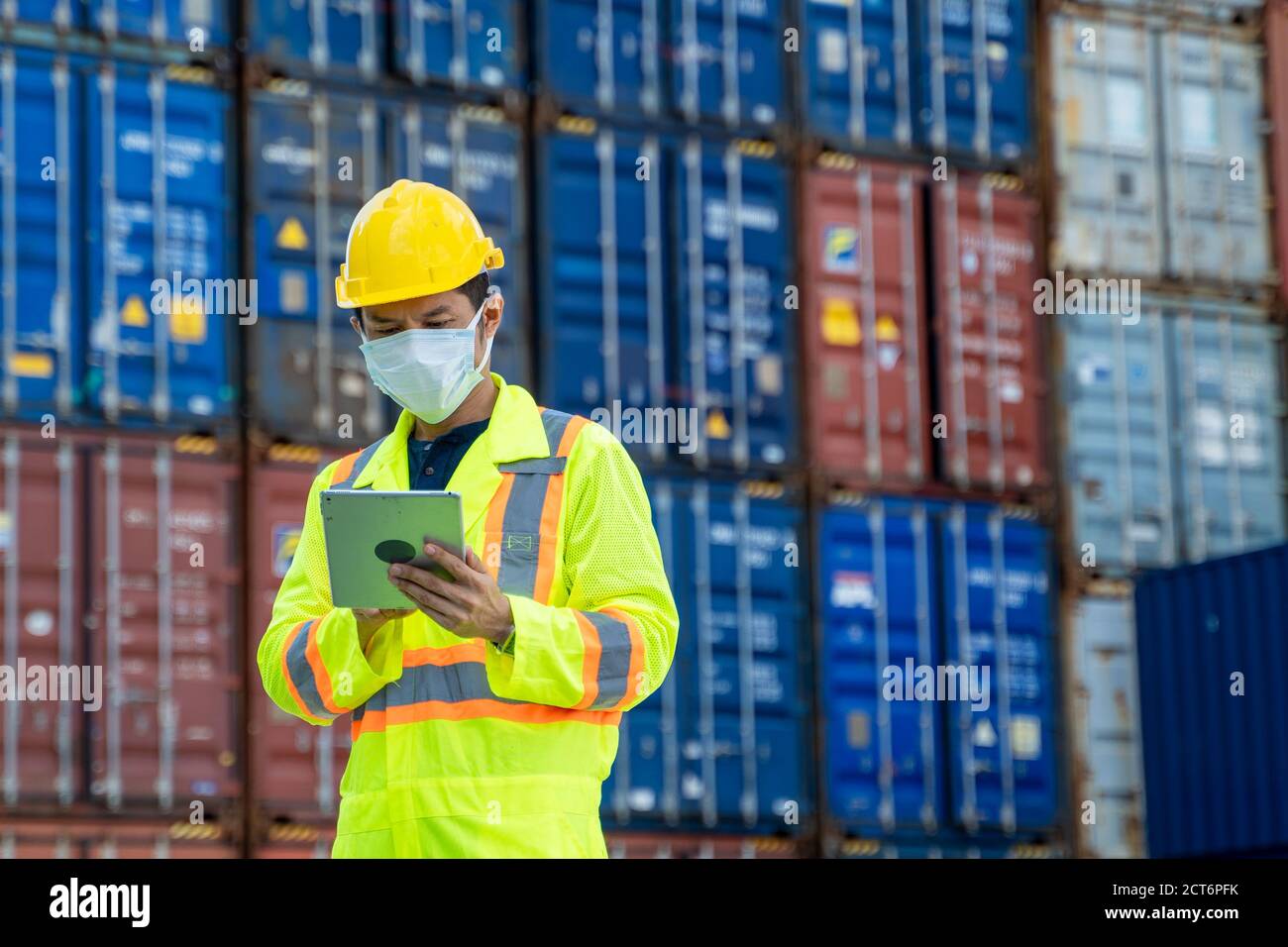 Container worker wearing protective mask to Protect Against Covid-19 ...