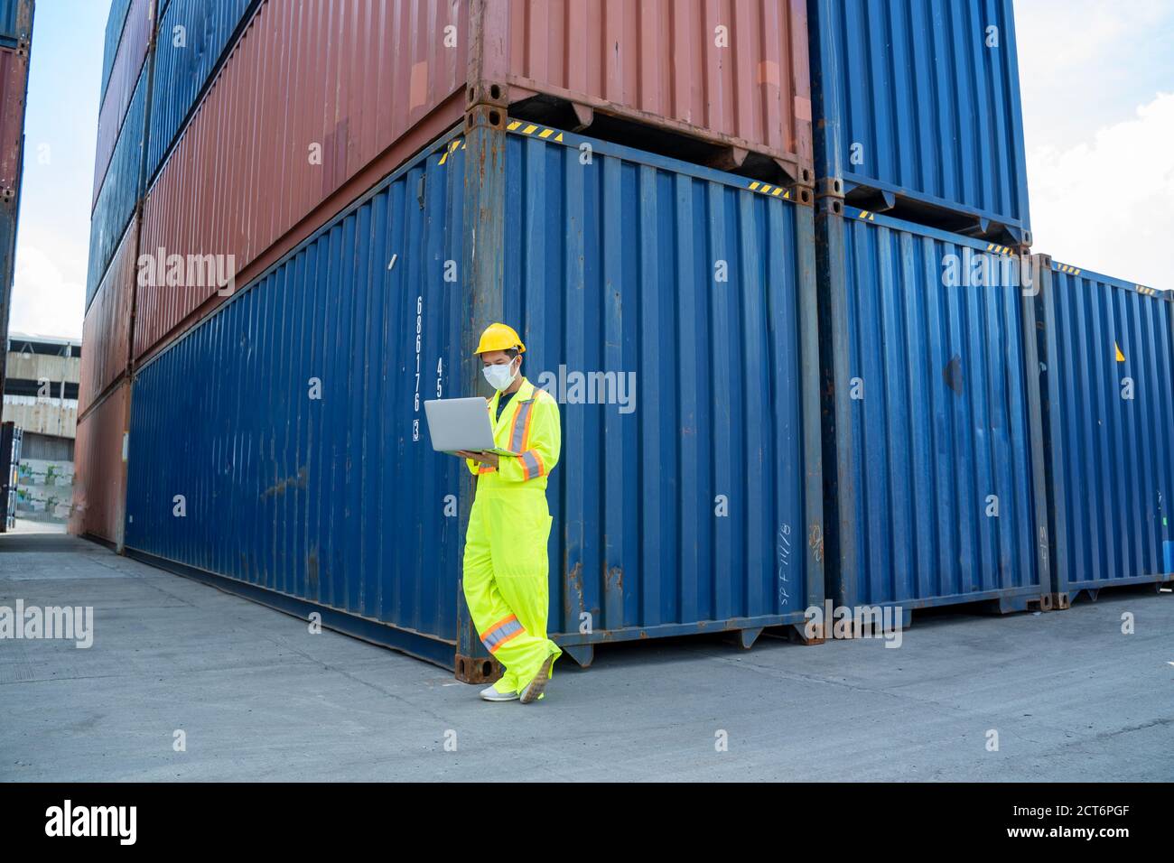 Engineer worker in protective safety jumpsuit uniform use laptop ...