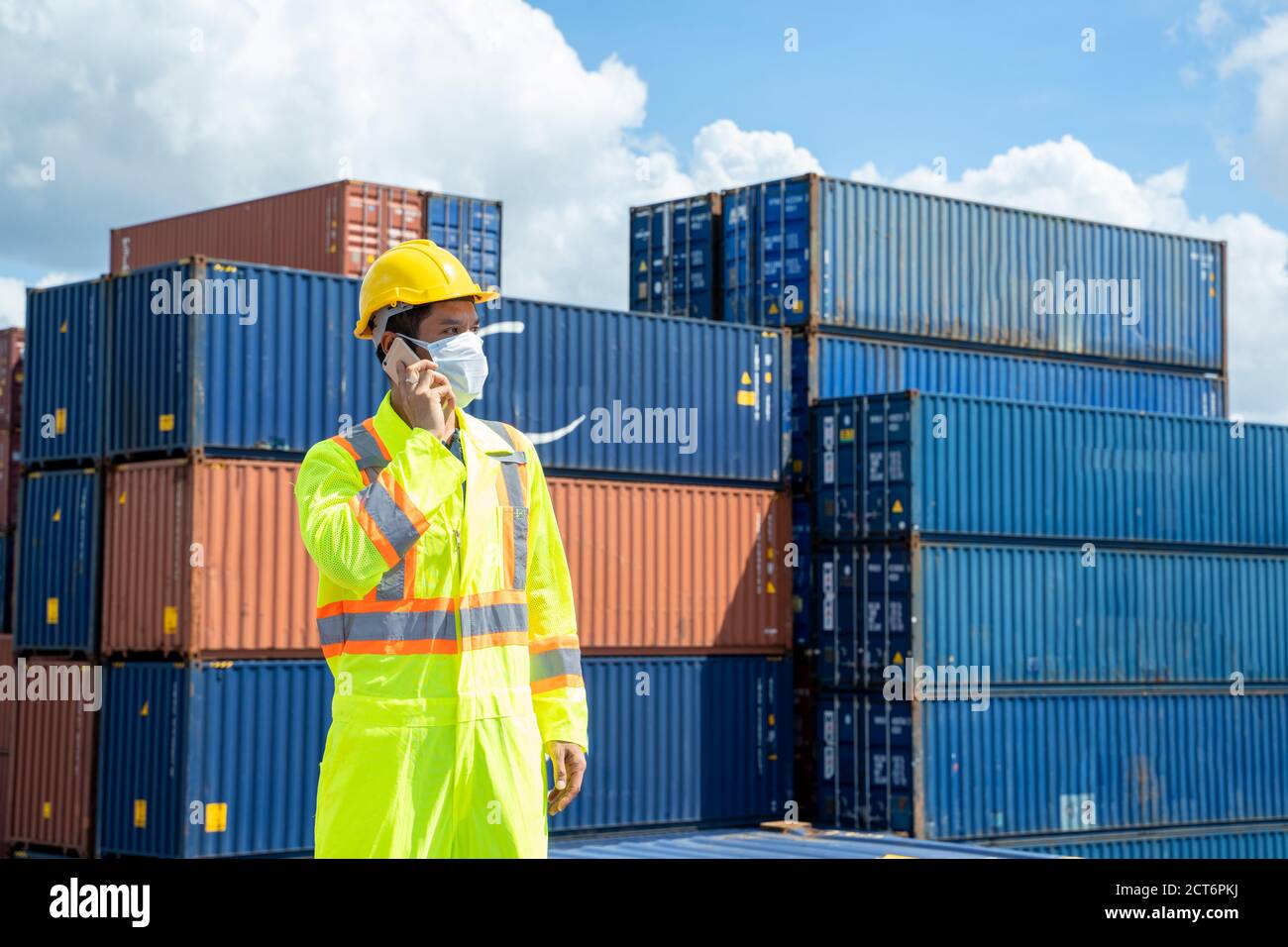 Container worker wearing protective face mask during corona virus and ...