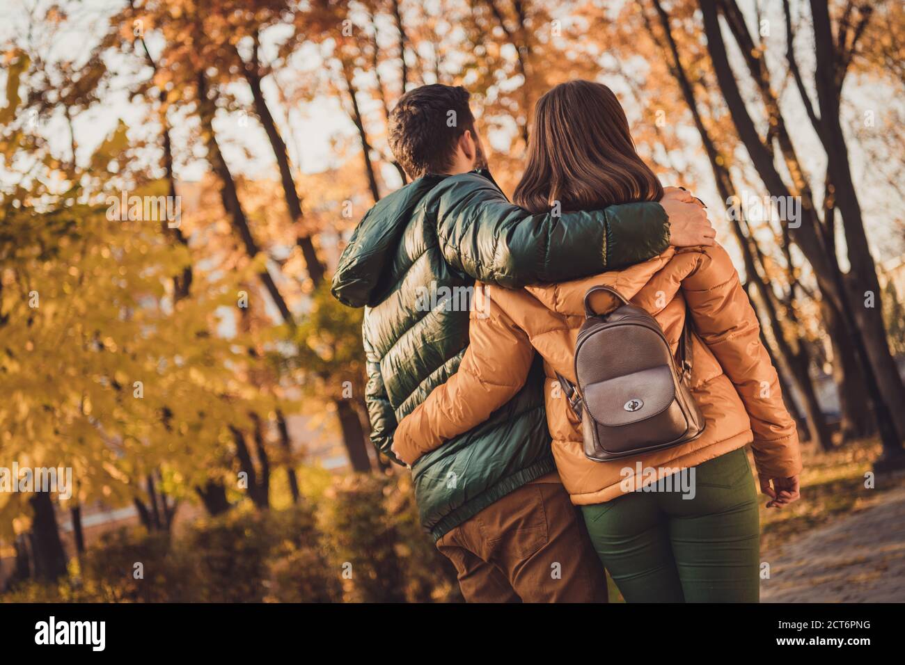 Back rear spine view photo of bonding romantic couple walk in autumn ...