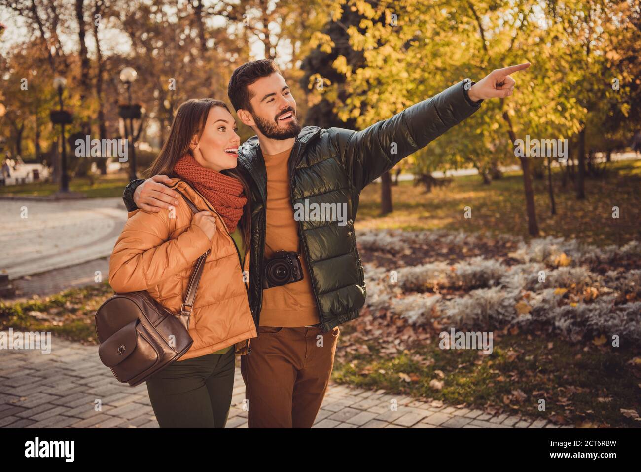 Photo of two people couple rest in fall forest park guy point finger ...