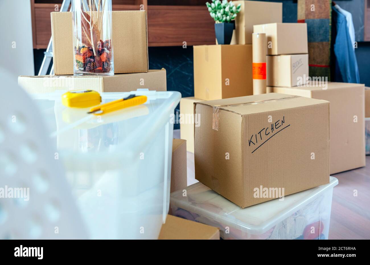 Living room with moving boxes Stock Photo - Alamy