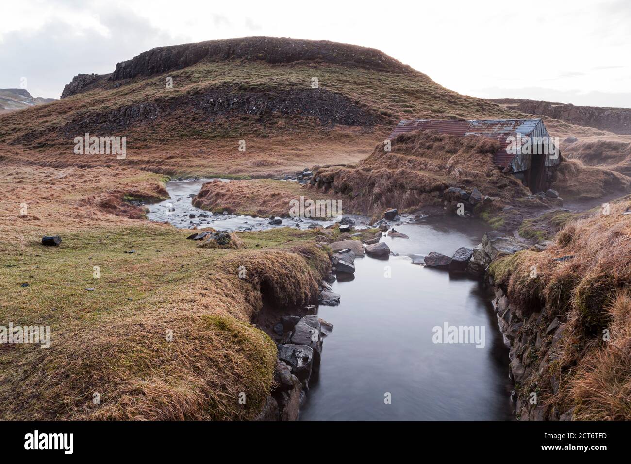 A empty natural hot spring, with hut for changing clothes, in rural ...