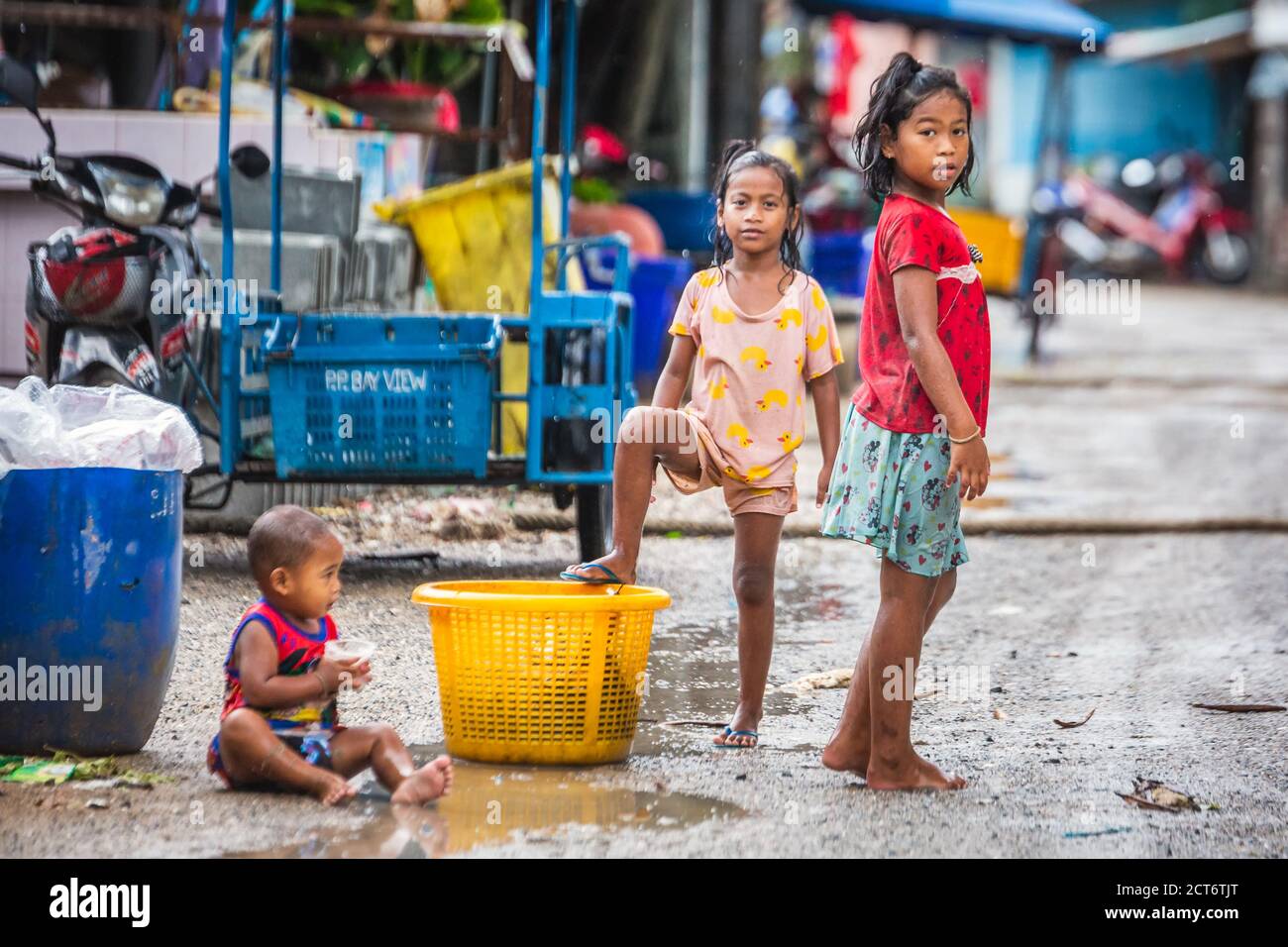 Lifestyle children in Thai countryside. Children playing water splash ...