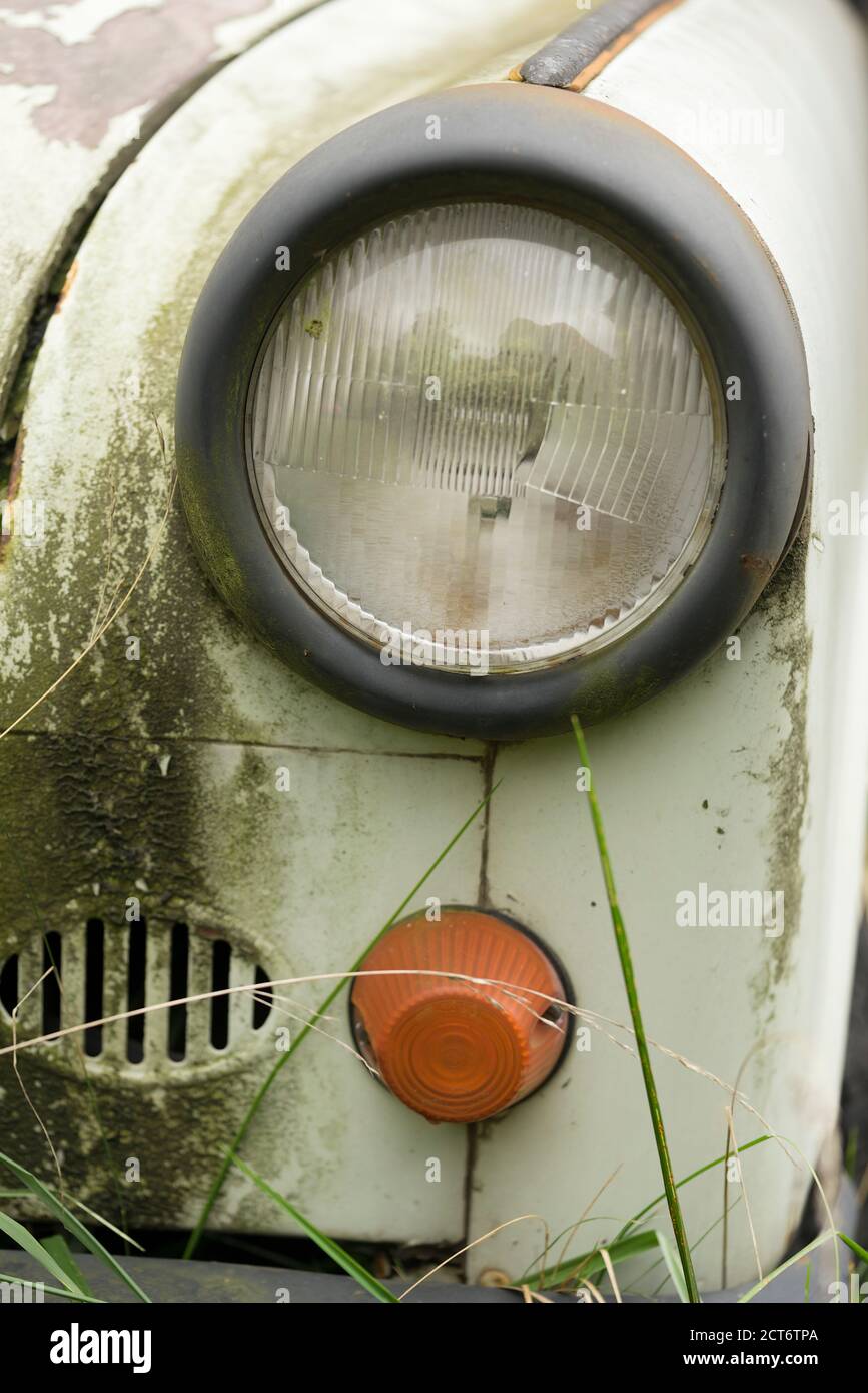 A Detail of the front light of an abandoned decay car urban exploration ...