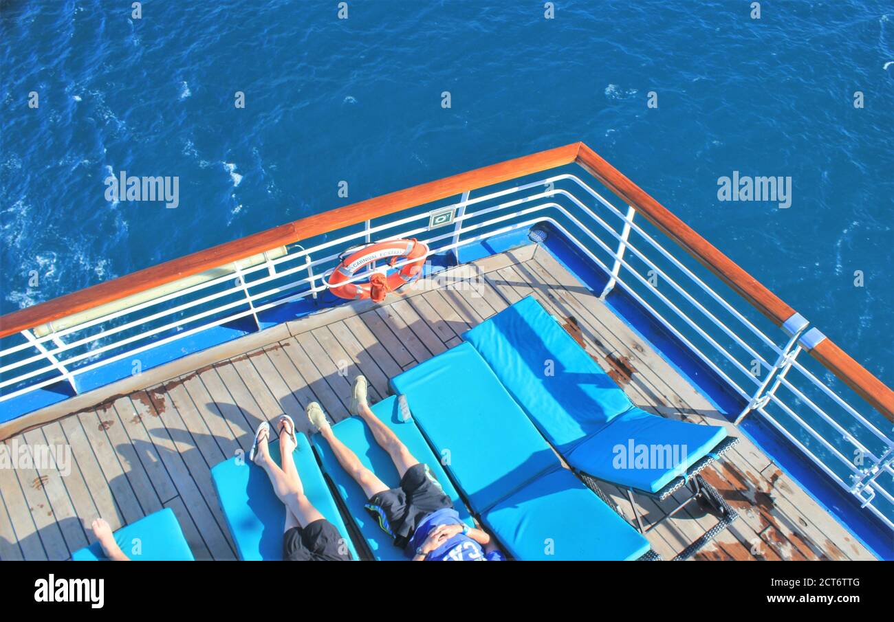 Cruise ship passengers sunbathing on deck Stock Photo - Alamy