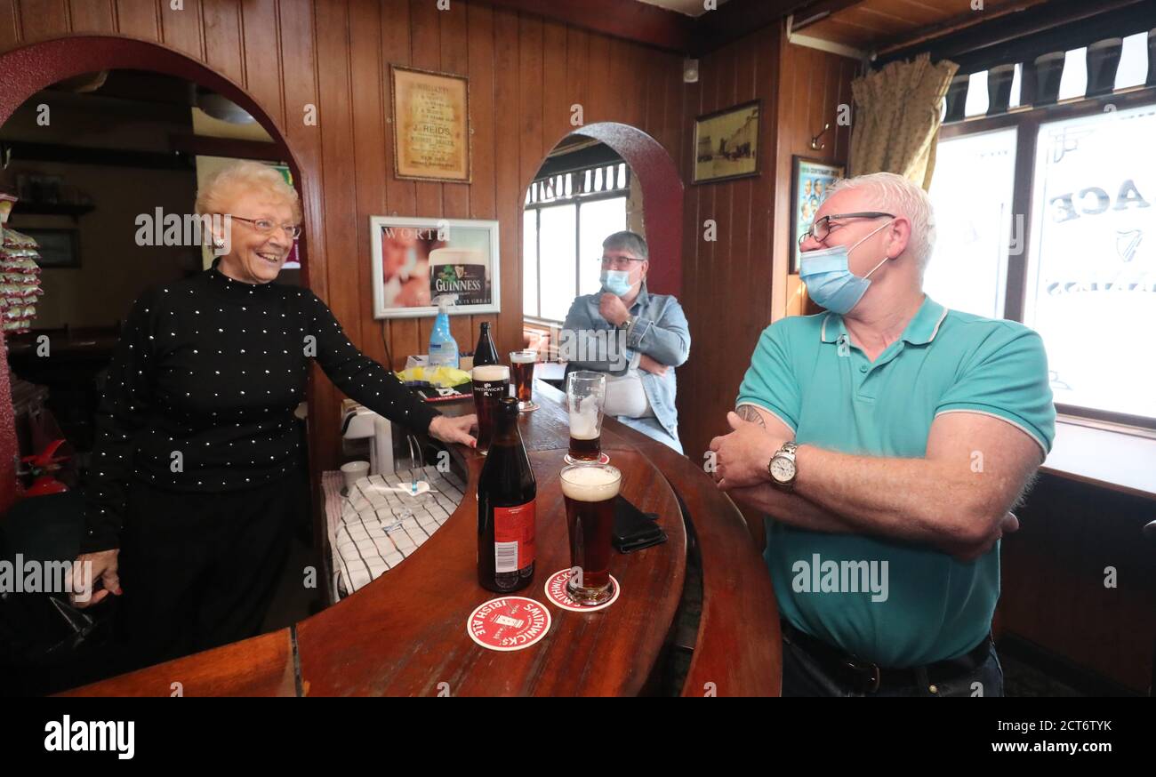Ann Cunningham speaks with brothers (left to right) Tim and Johnny ...