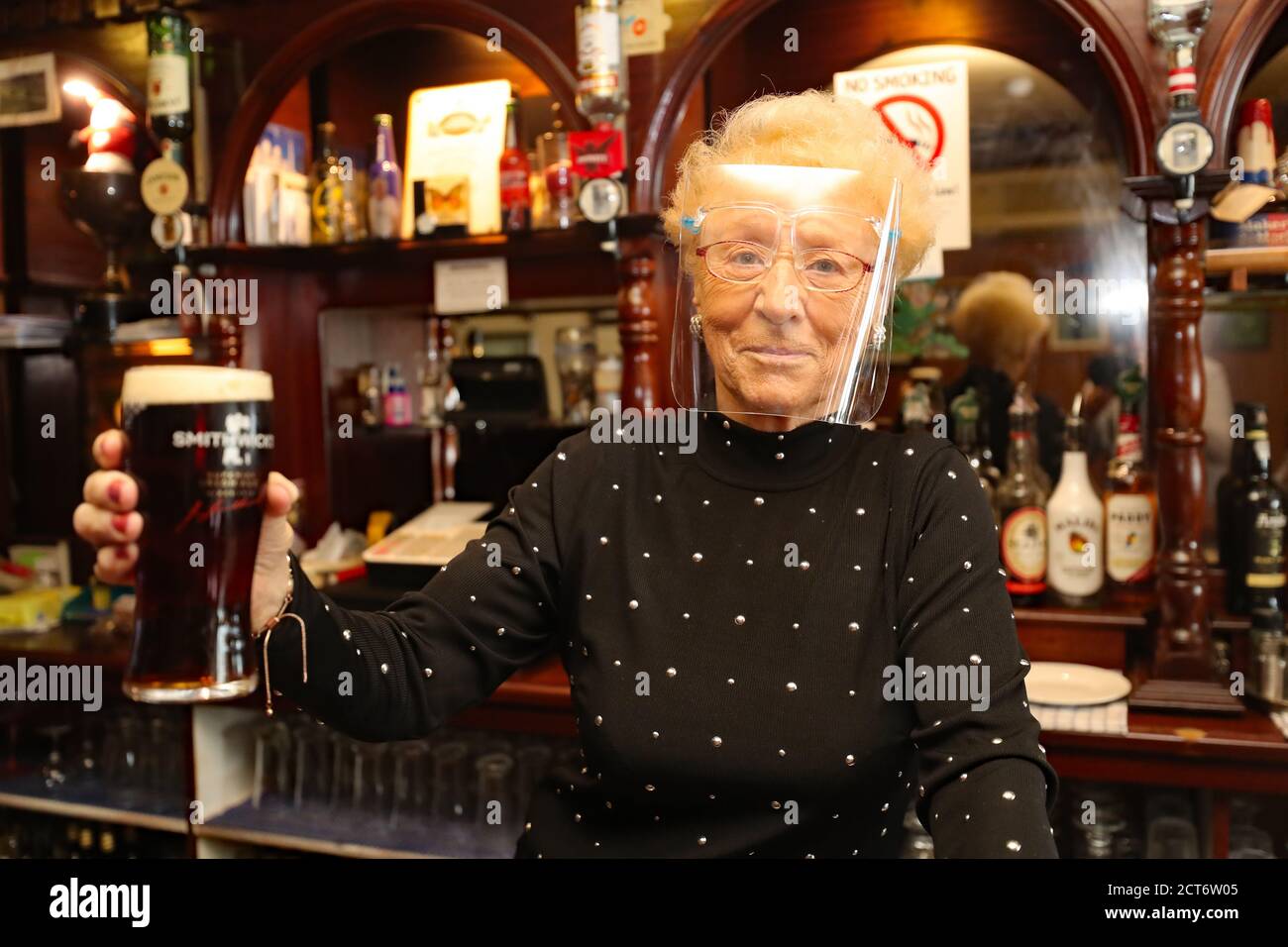 Landlady Ann Cunningham with a pint of beer in her pub Ann's Place in ...