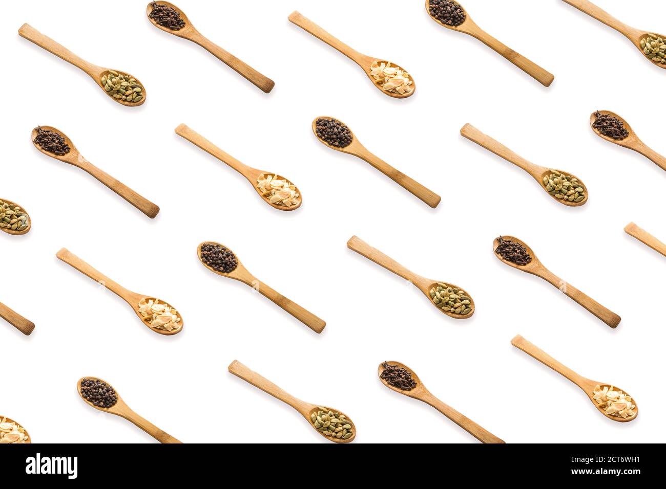 White background with wooden spoons with different condiments. Food ...
