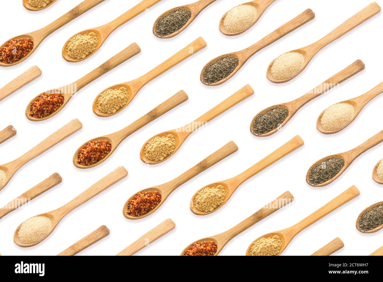 White background with wooden spoons with different condiments. Food ...
