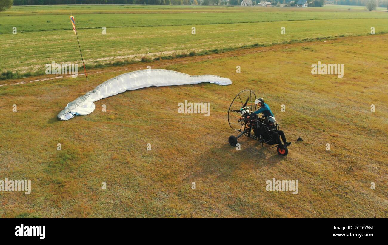 Paramotor gliding tandem preparing to take off. High quality photo ...