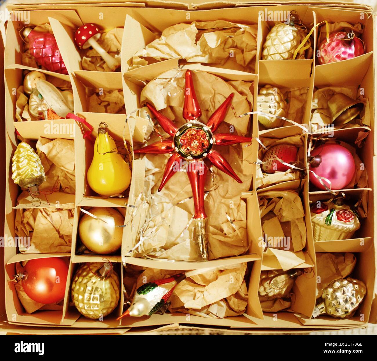 Open cardboard box with vintage Christmas decorations made of glass ...