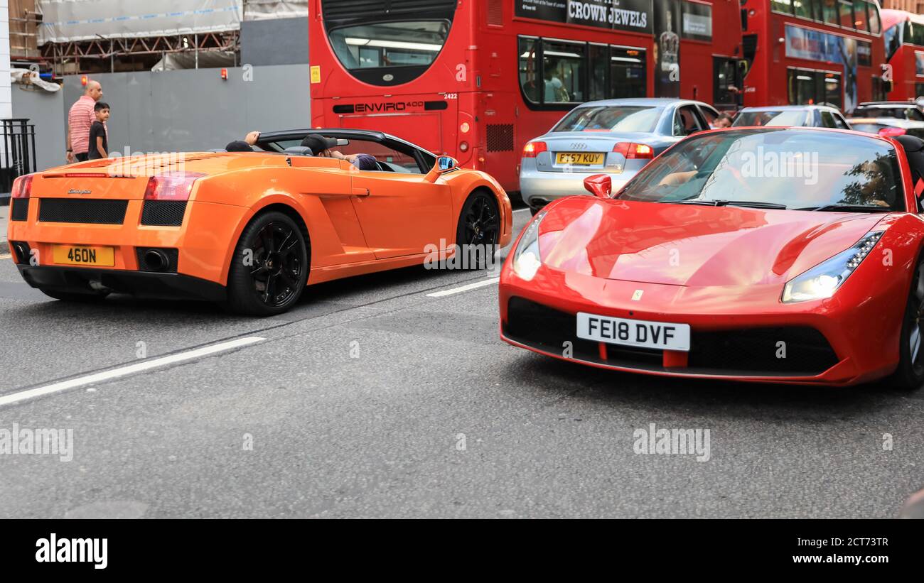 Orange Lamborghini and red Ferrari. Supercars in Sloane Street for ...