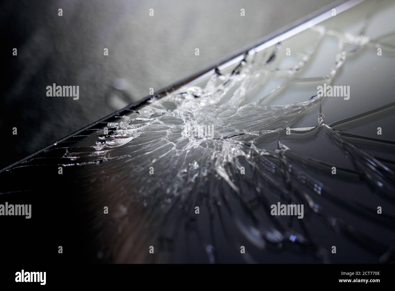 Broken mobile phone display, cracks close up Stock Photo - Alamy
