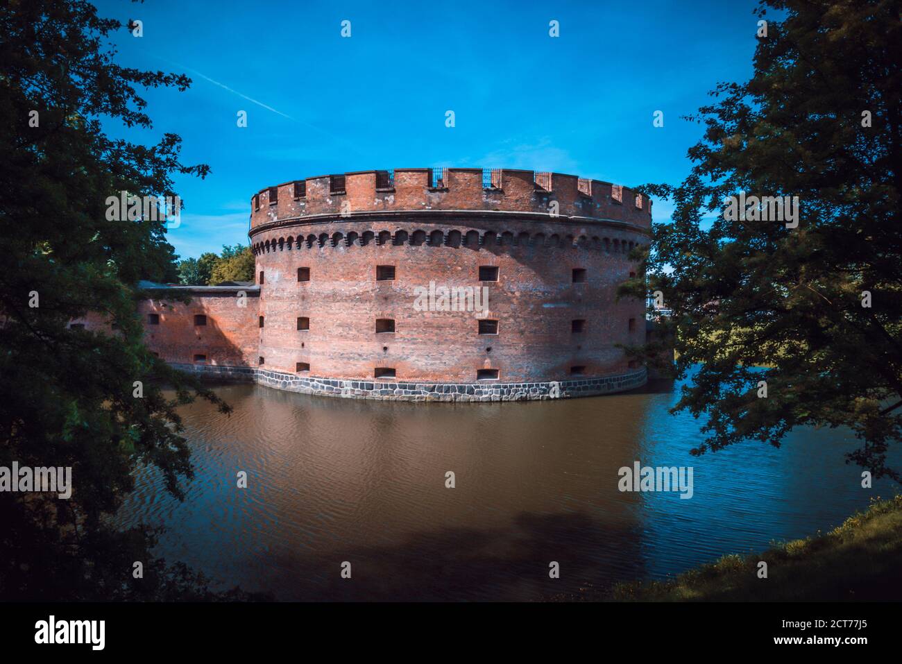An old red brick fortress on the beach . Historical antique world ...