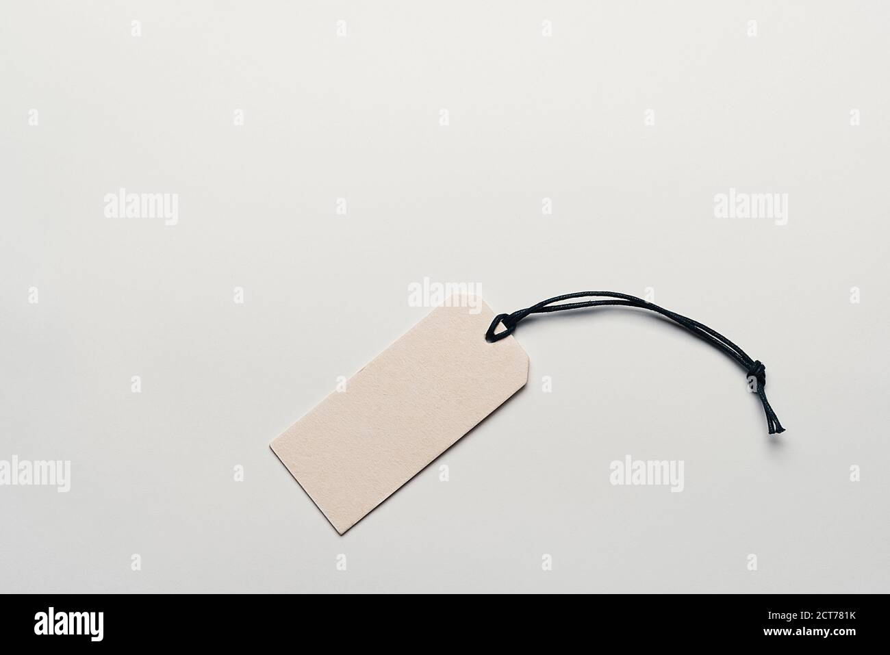 The price tag made of cardboard is empty without inscriptions on a ...