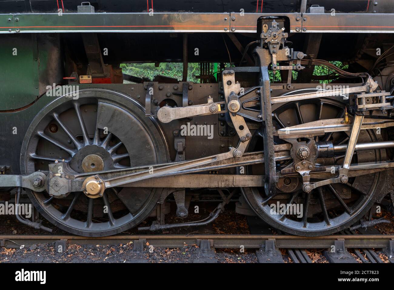 Closeup detail of vintage steam engine mechanics. Wheels and driving ...