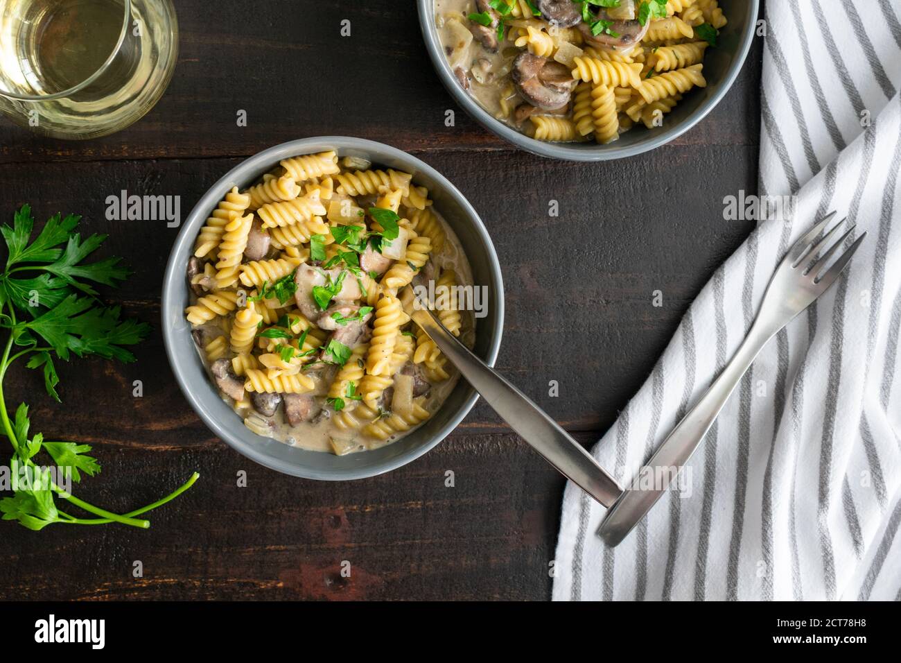 Vegan Mushroom Stroganoff: Bowls of rotini pasta and cremini mushrooms ...