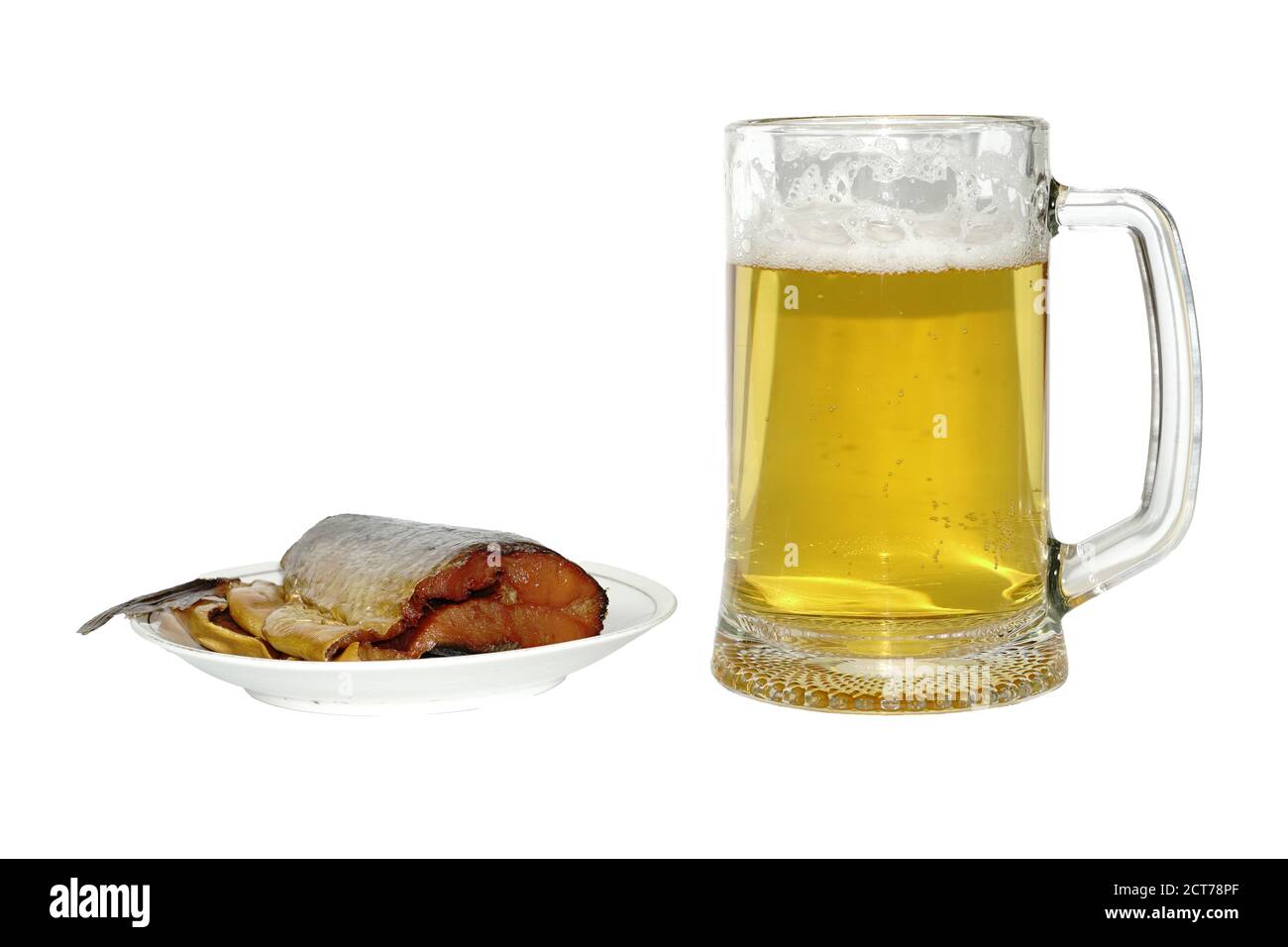 Glass with amazing beer, a piece of fish on a plate on a white ...