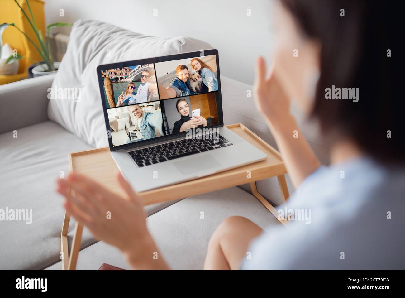 Online video call to friends via computer. Girl waves people hand ...