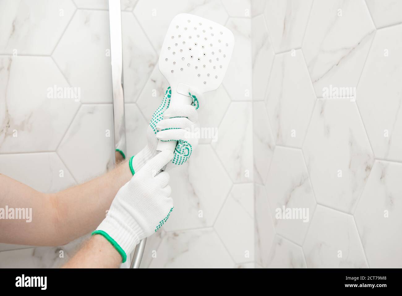 Plumber installing shower stall, work in bathroom Stock Photo - Alamy