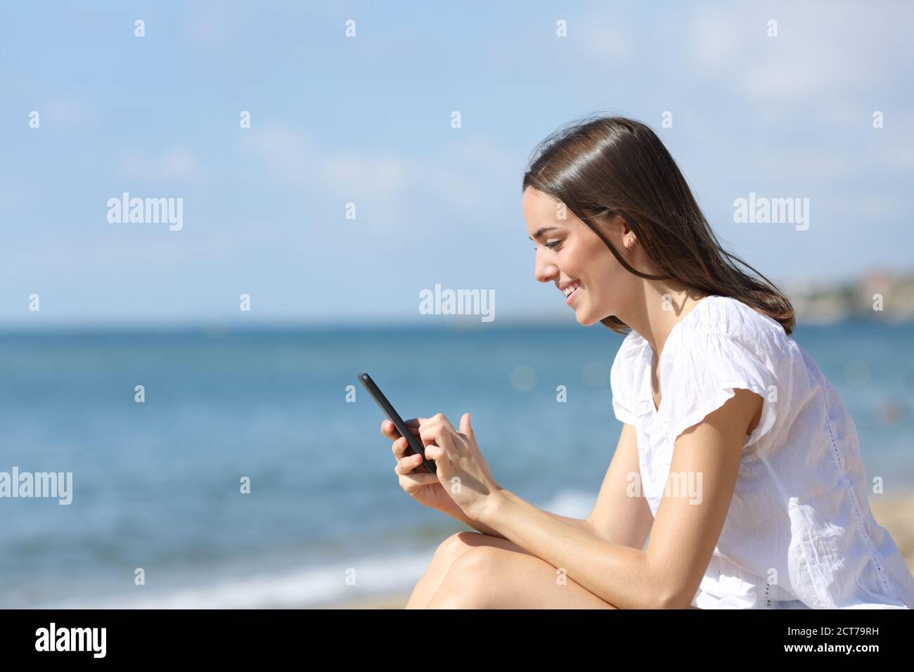 Woman beach watching hi-res stock photography and images - Alamy
