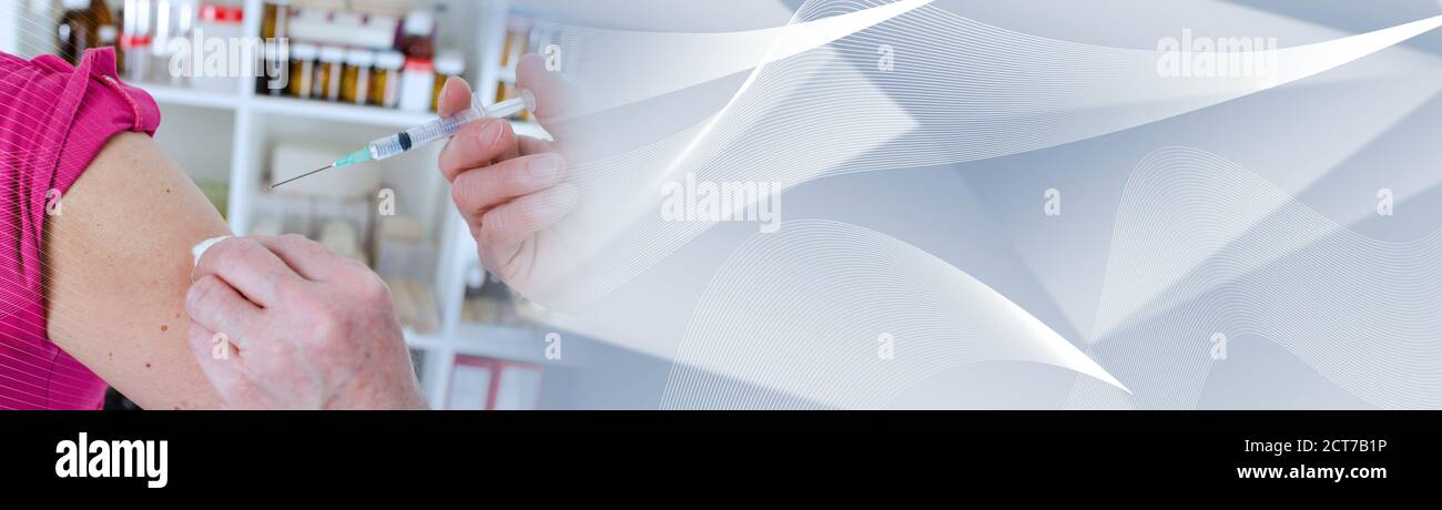 Doctor about to give an injection to his patient in medical office ...