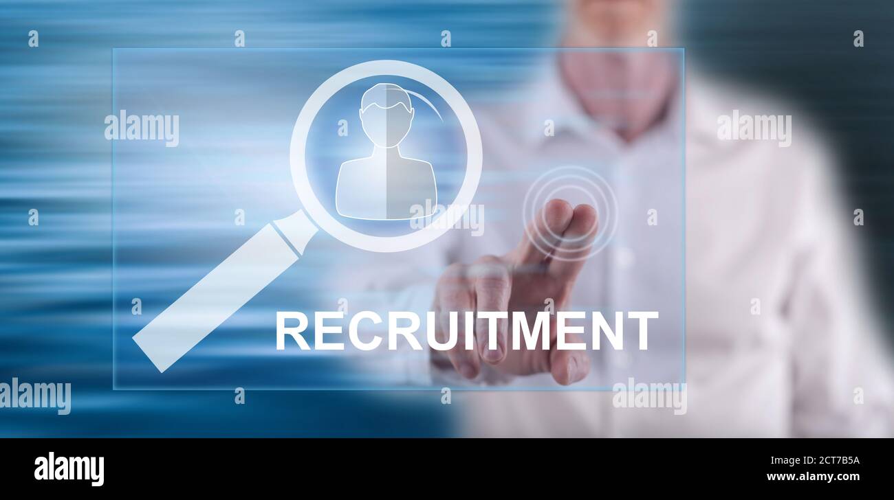 Man touching a recruitment concept on a touch screen with his finger ...