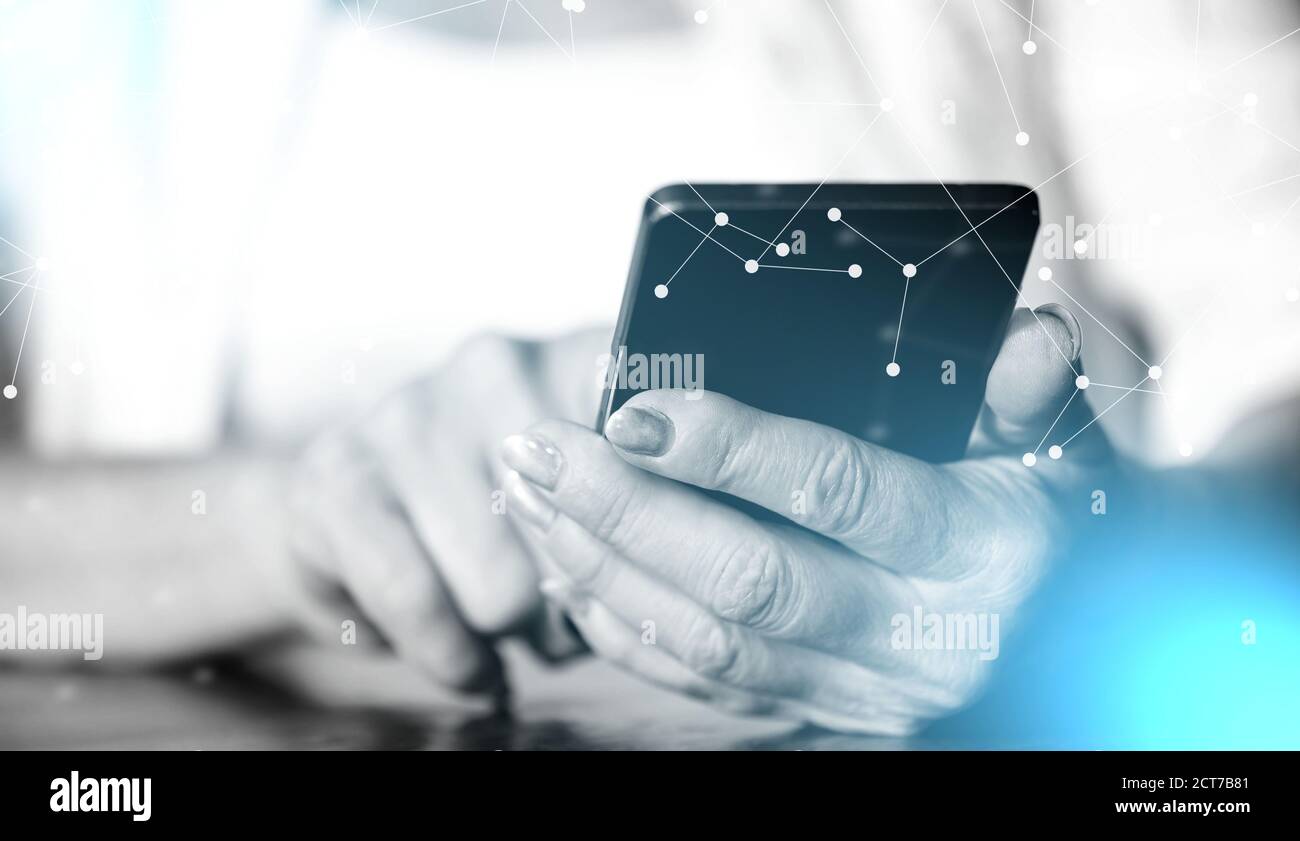 Close up of woman's hands using a mobile phone; light effect Stock ...