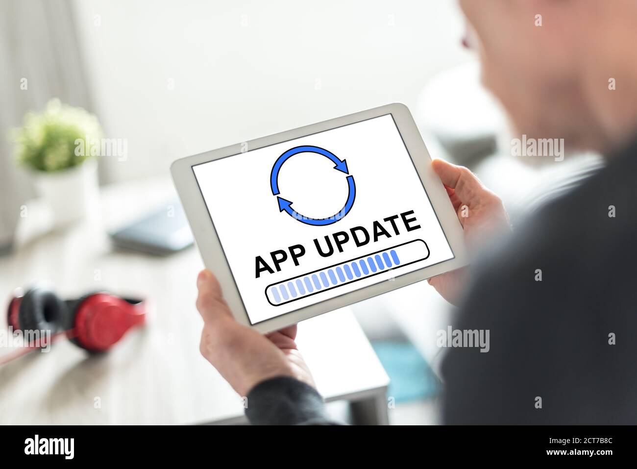 Tablet screen displaying an app update concept Stock Photo - Alamy