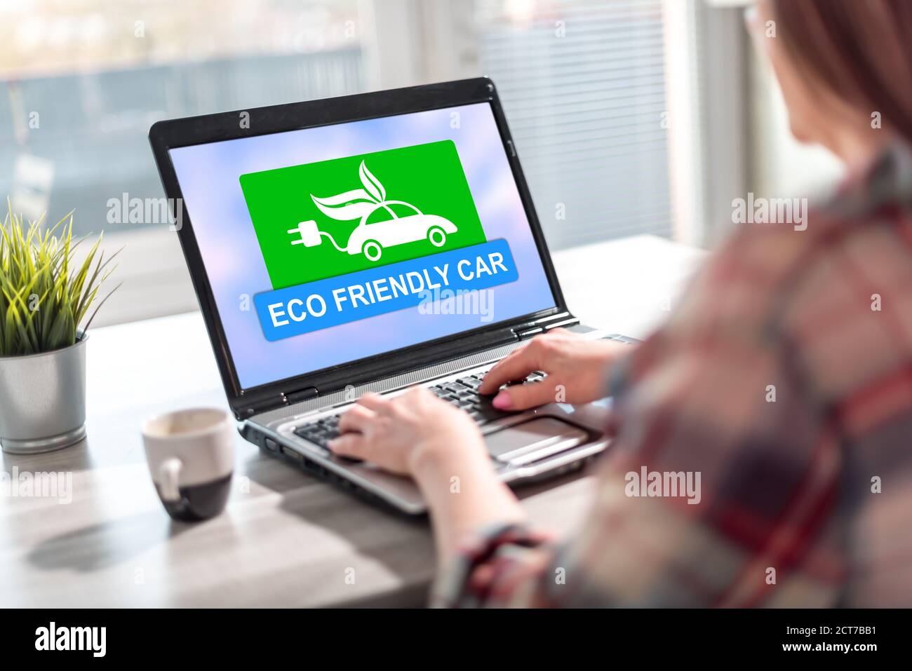 Laptop screen displaying an eco friendly car concept Stock Photo - Alamy