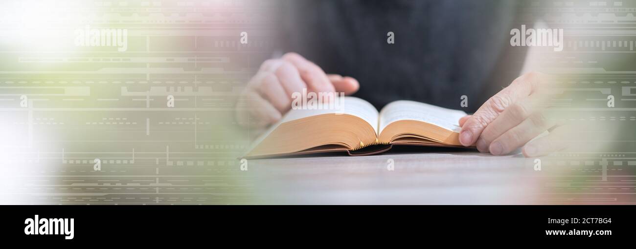 Man sitting and reading a book; panoramic banner Stock Photo - Alamy